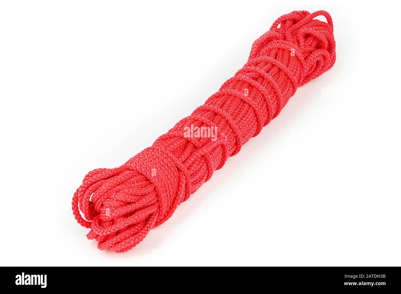 reeled up red nylon rope isolated on white background Stock Photo - Alamy