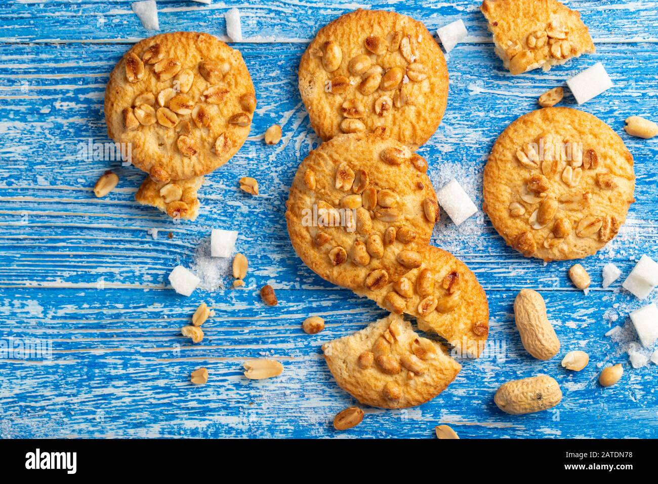 homemade shortbread cookies with peanuts scattered on the table. place ...