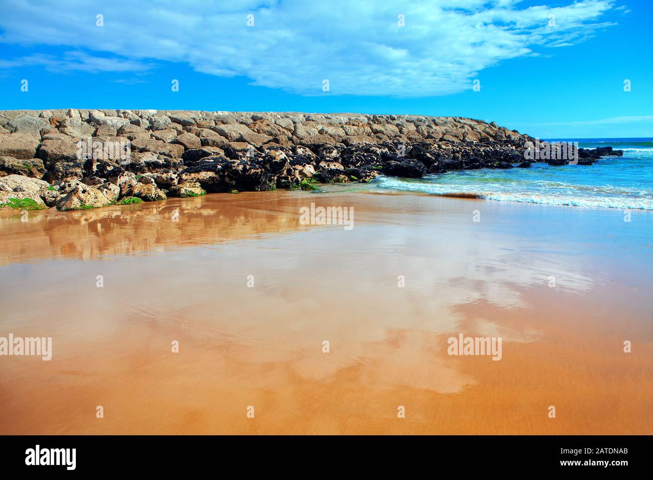 ocean dam and sandy beach Stock Photo - Alamy