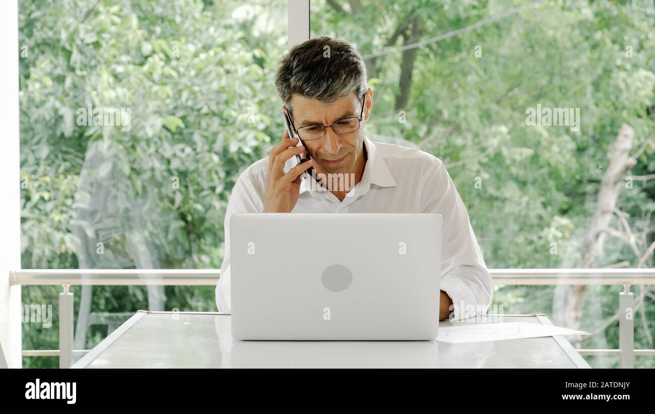 Male businessman in the office at work Stock Photo - Alamy