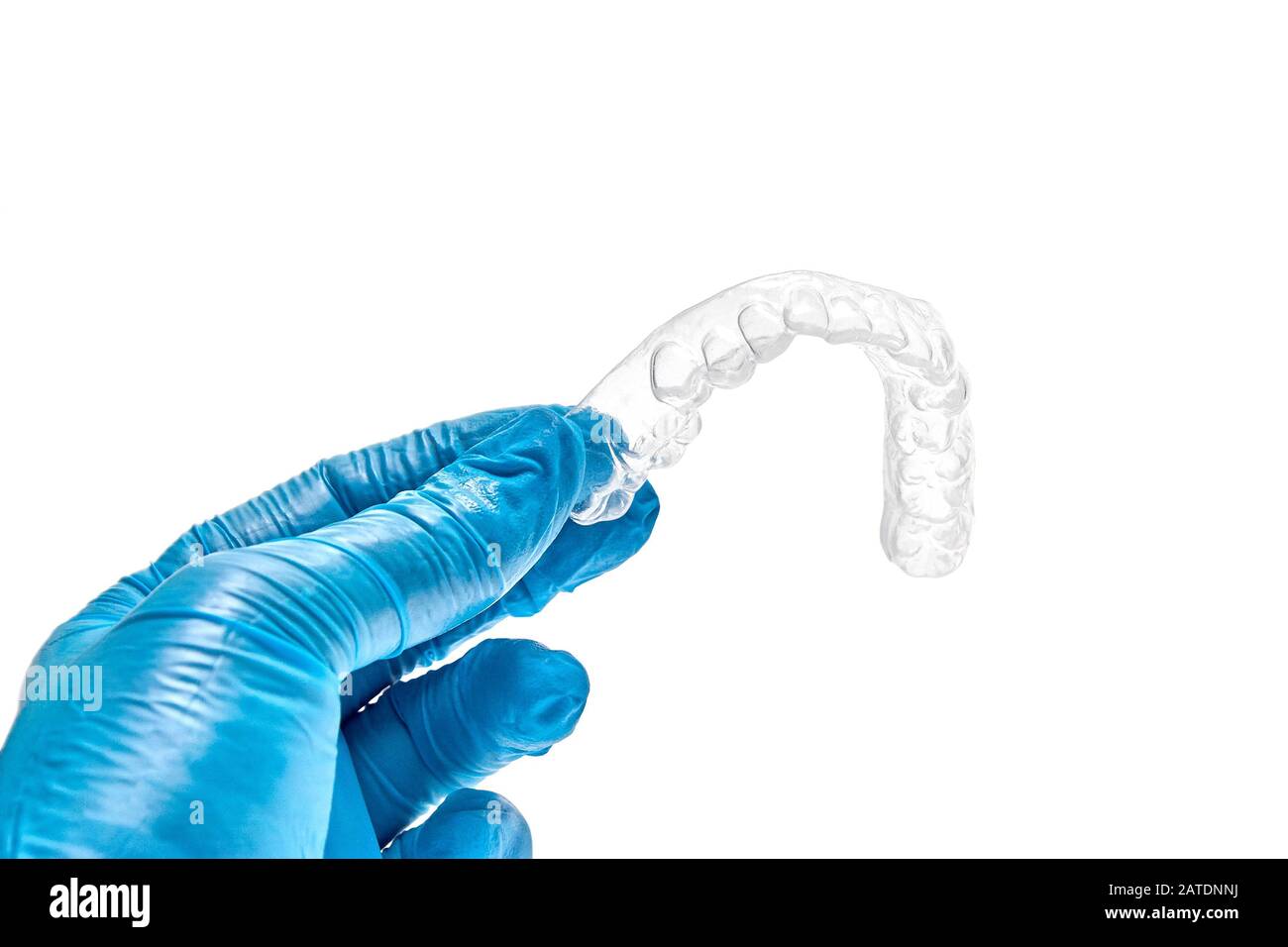 Hand holding individual dental tray for bleaching teeth Isolated on a ...