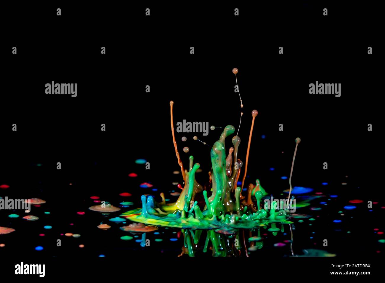 Splash of green ink on black background, abstract illustration of a ...