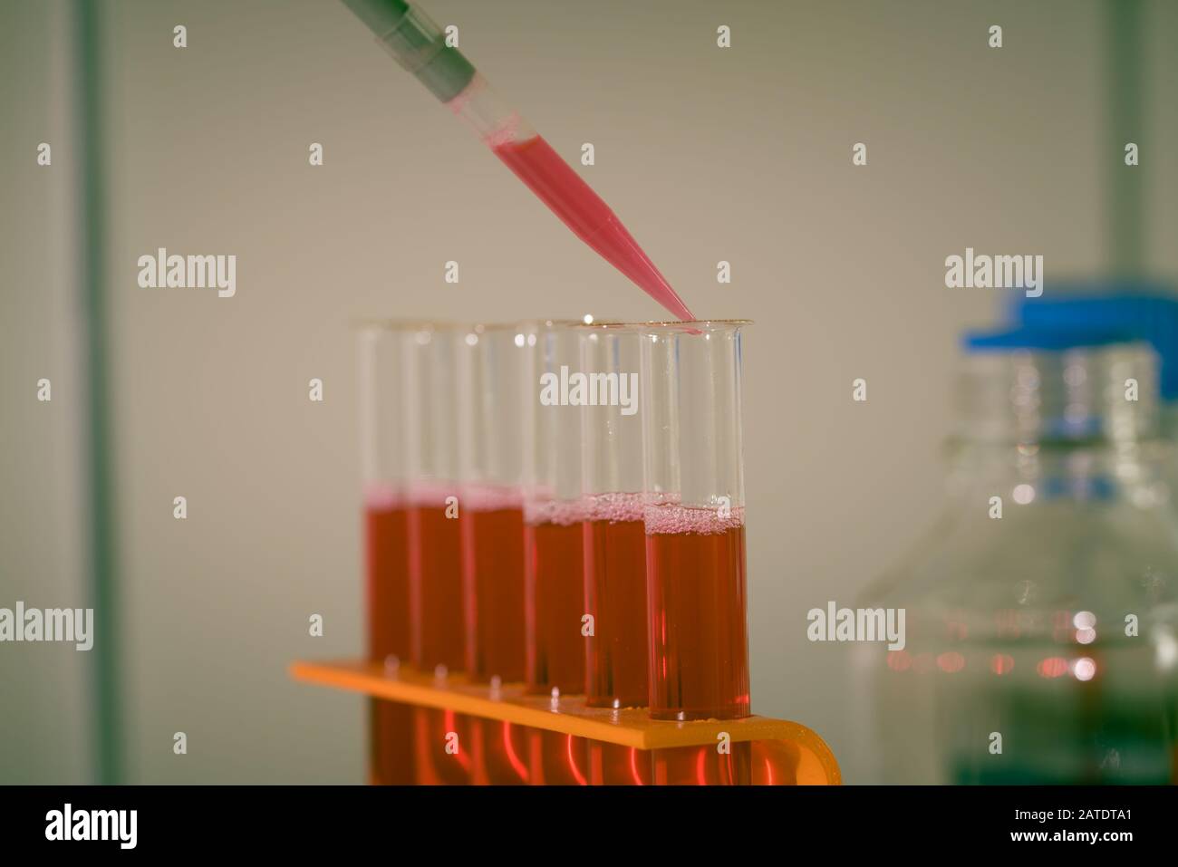 Test tube in rack and pipette media dispenser Stock Photo - Alamy
