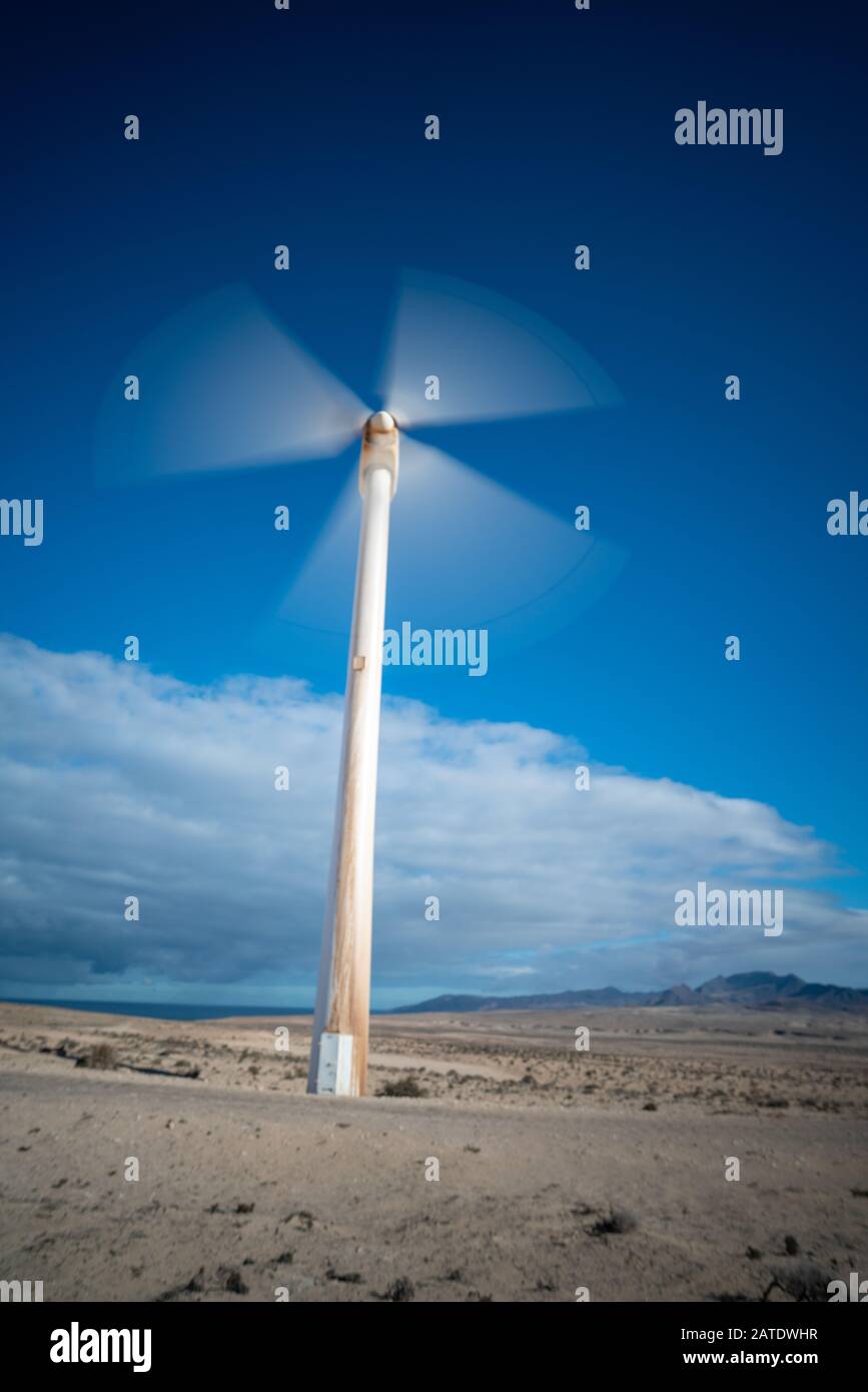 wind turbine in the desert with blue sky background. wind mill farm in ...