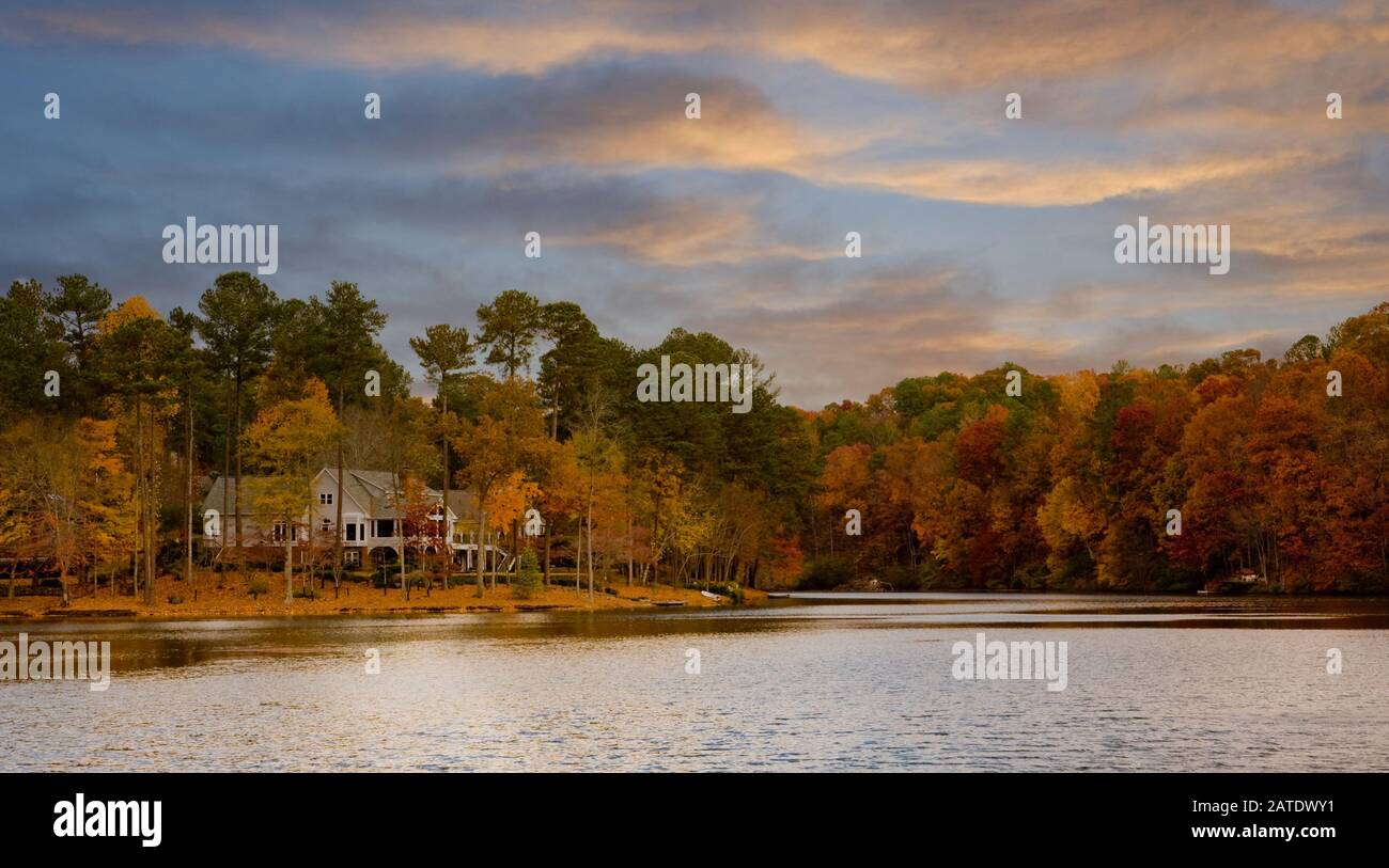 Lakeside Home in Sunset Sky Stock Photo - Alamy