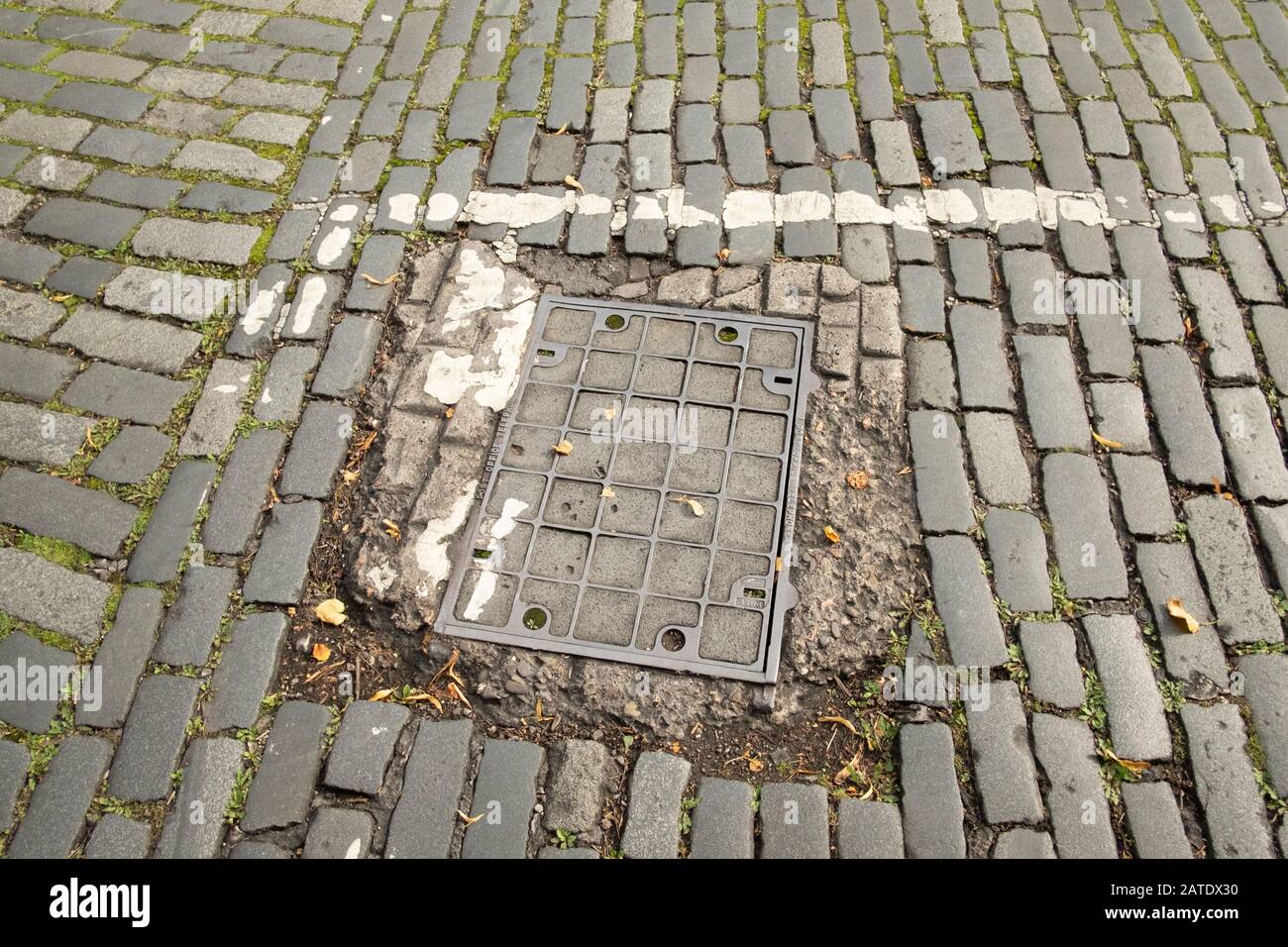 Manhole cover in road hi-res stock photography and images - Alamy