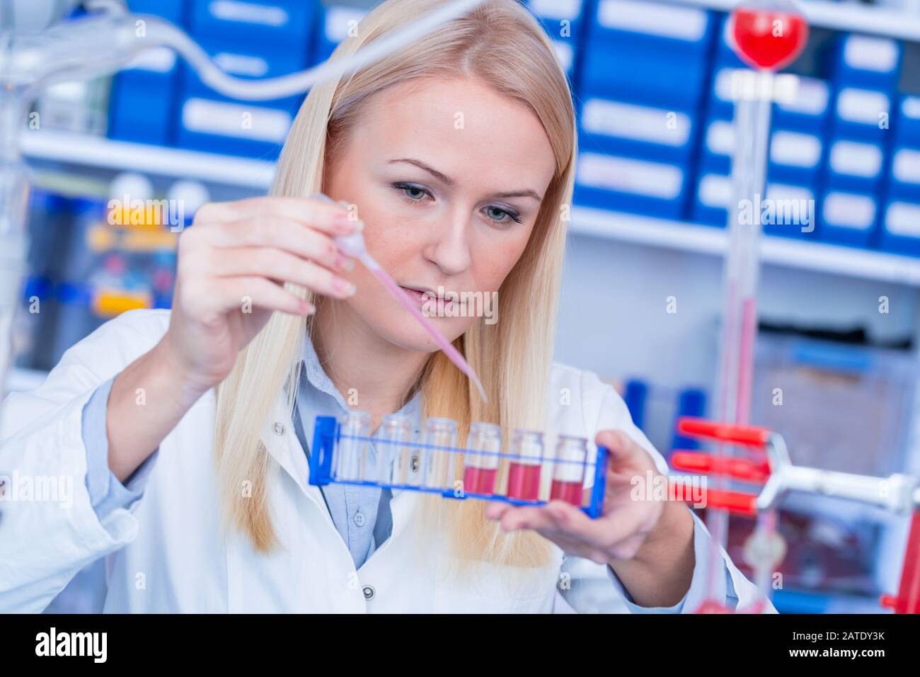 Girl laboratory Assistant works with an antiviral drug in a ...