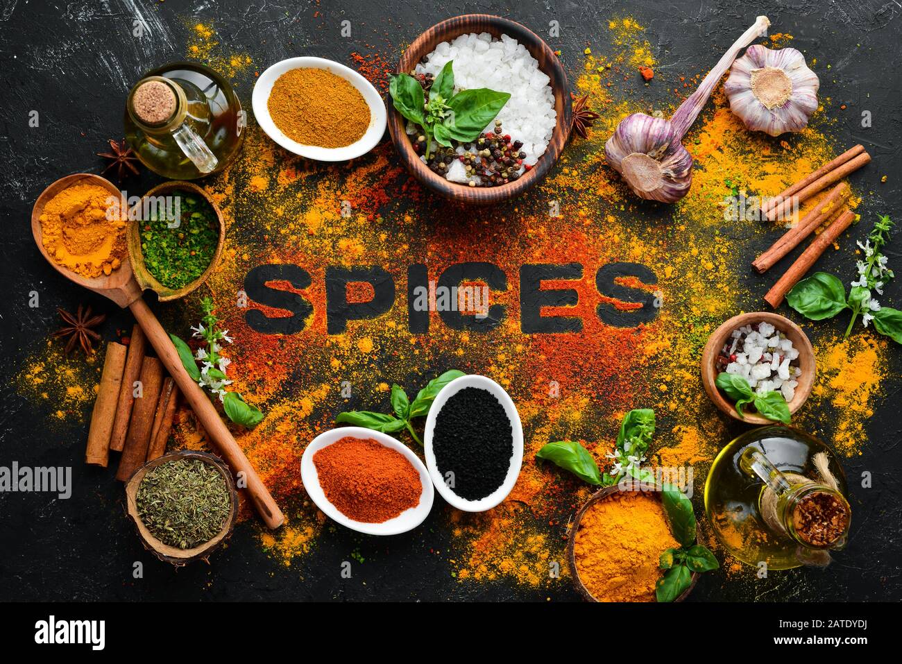 Indian spices on a black stone background. The word "spice" Indian ...