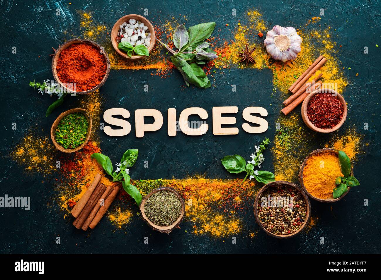 Indian spices on a black stone background. The word "spice" Indian ...