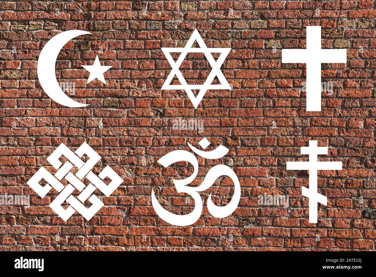 Symbol of different religions on brick wall Stock Photo - Alamy