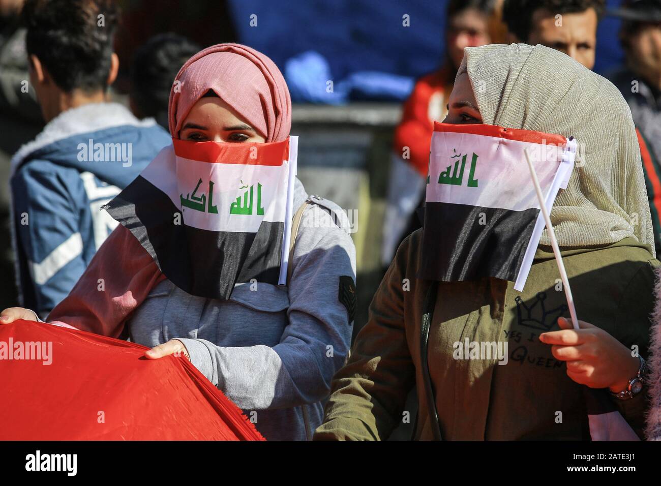 Baghdad, Iraq. 02nd Feb, 2020. Iraqi students wave flags of Iraq during ...