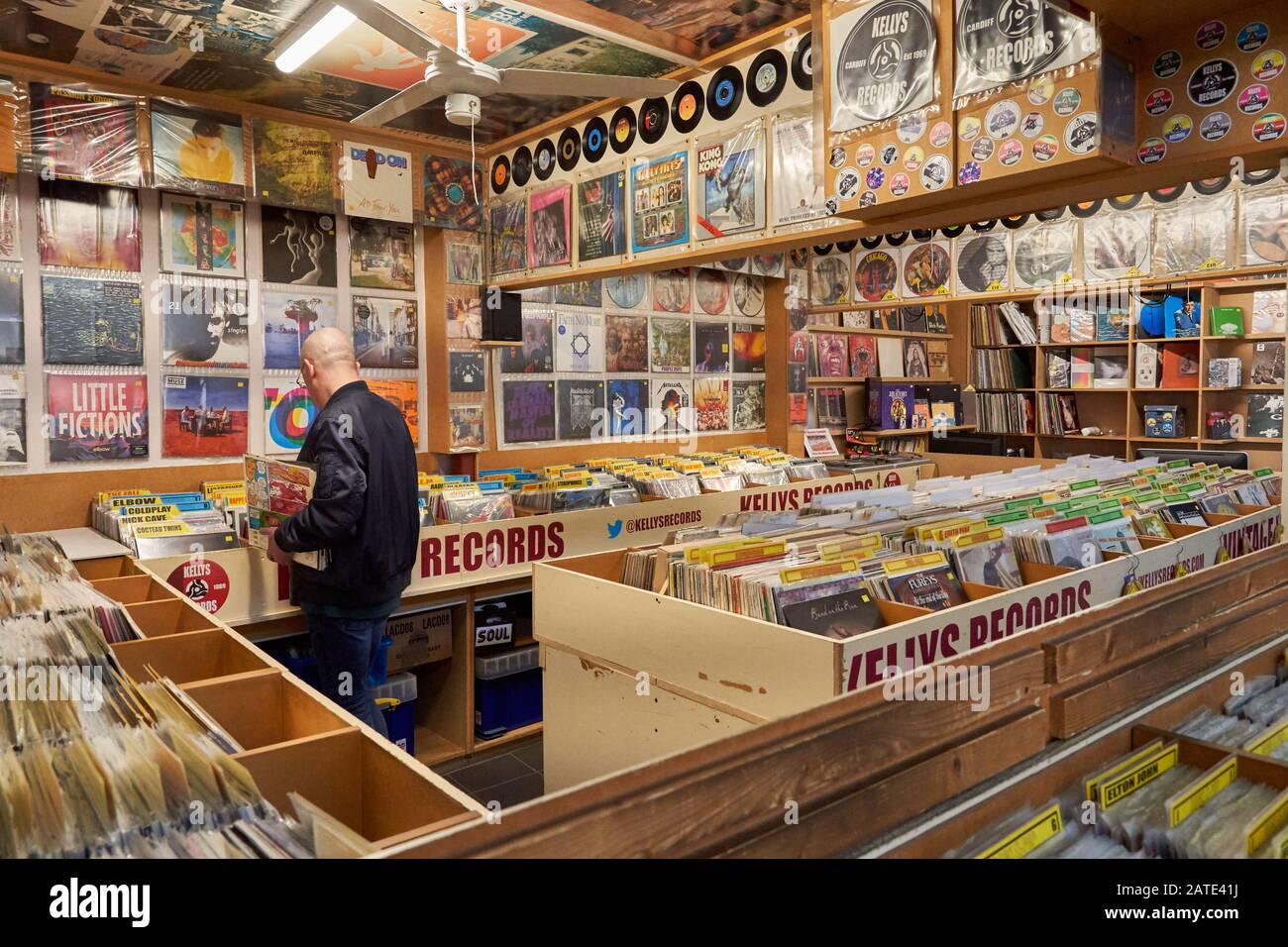 Shopper browsing vinyl records in Kelly's Records, Cardiff indoor ...