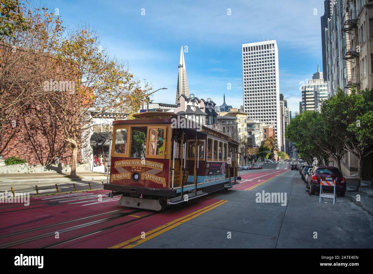 Classic view of historic traditional Cable Cars riding on famous ...
