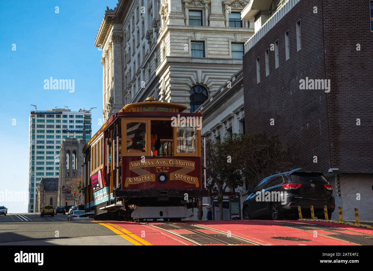Classic view of historic traditional Cable Cars riding on famous ...