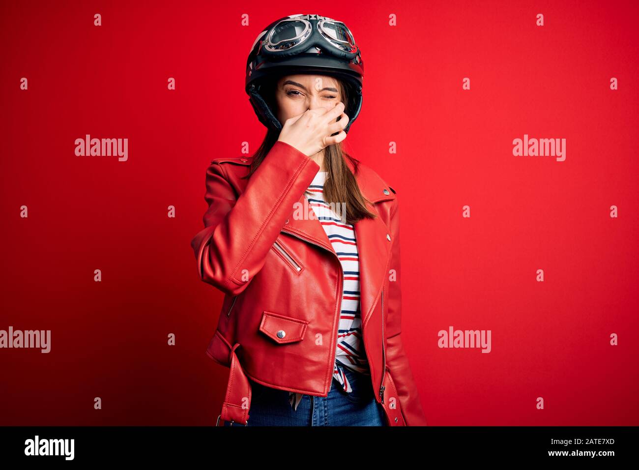 Young woman wearing dirty motorcycle helmet hi-res stock photography ...