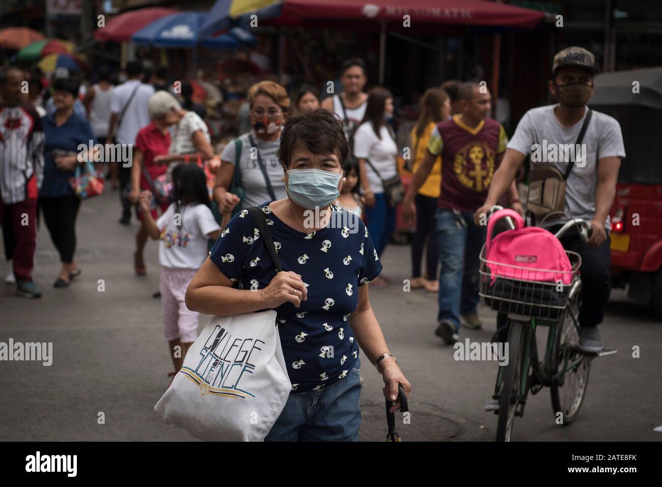 A Filipino wearing a face-mask following the virus outbreak.Fear ...