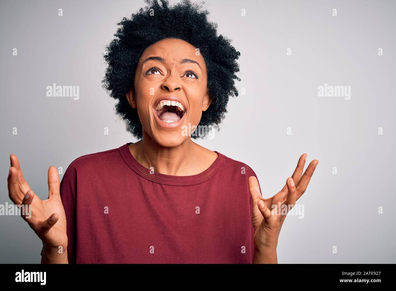 Young beautiful African American afro woman with curly hair wearing ...