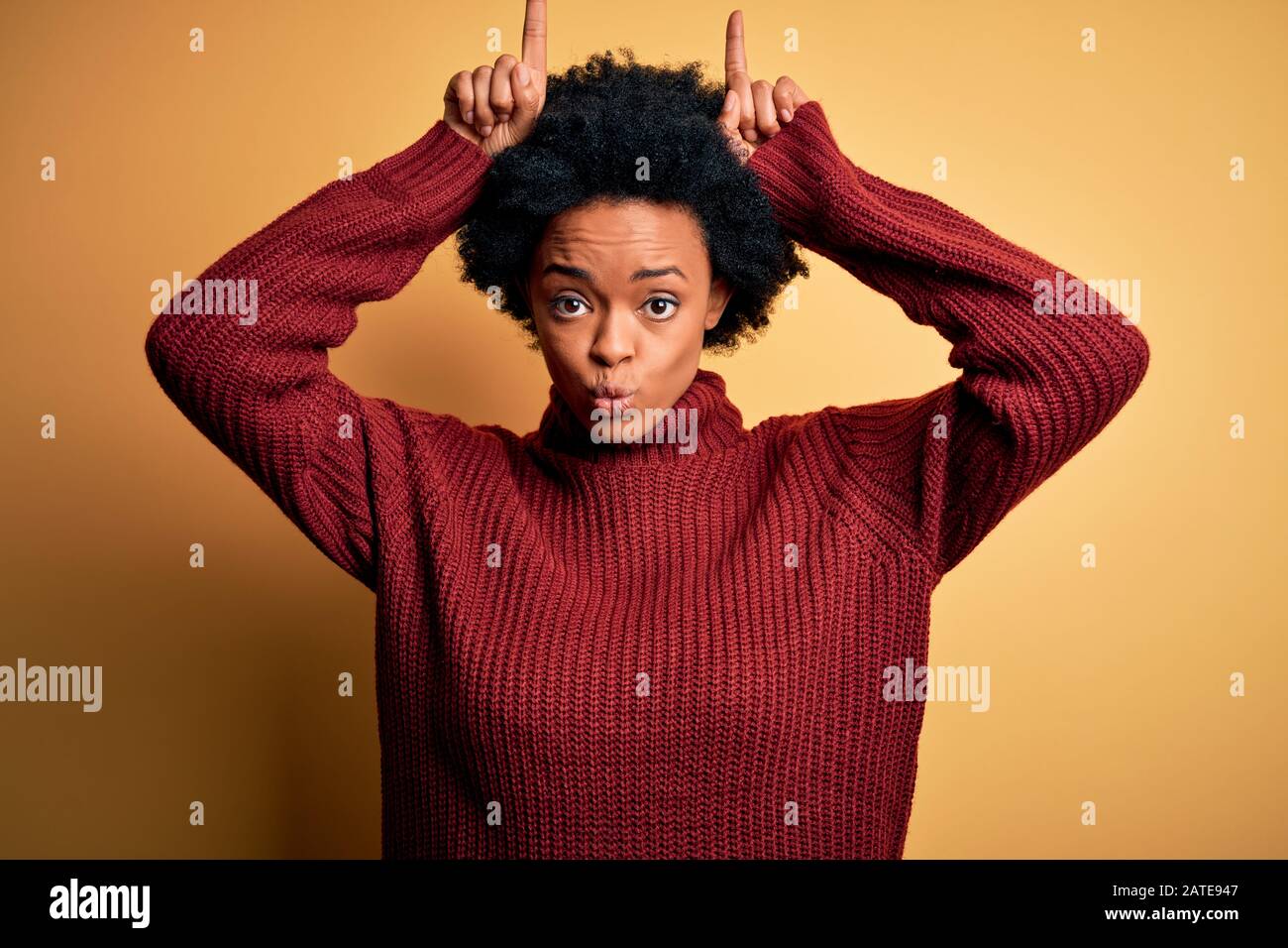 Young beautiful African American afro woman with curly hair wearing ...