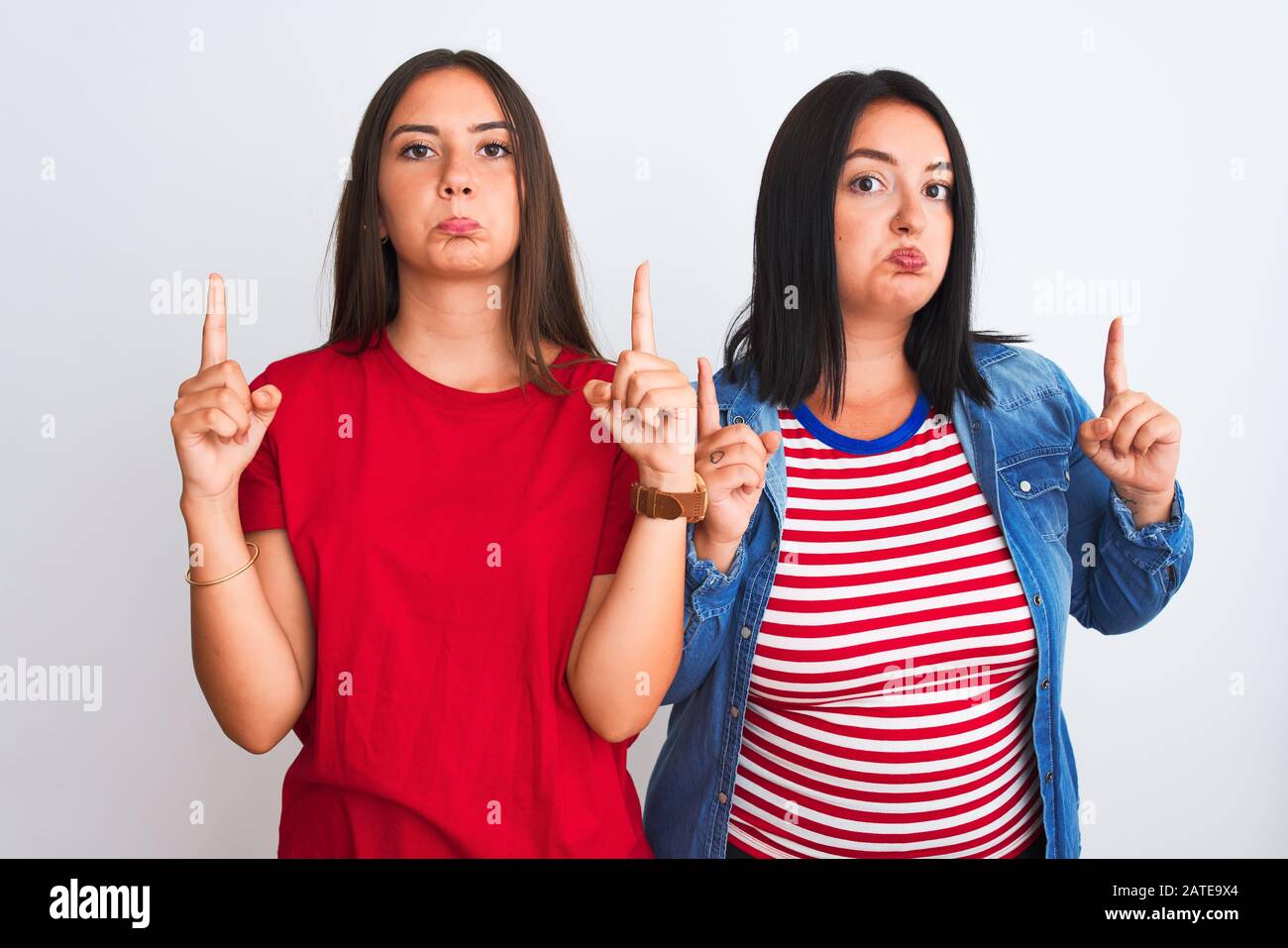 Young beautiful women wearing casual clothes standing over isolated ...