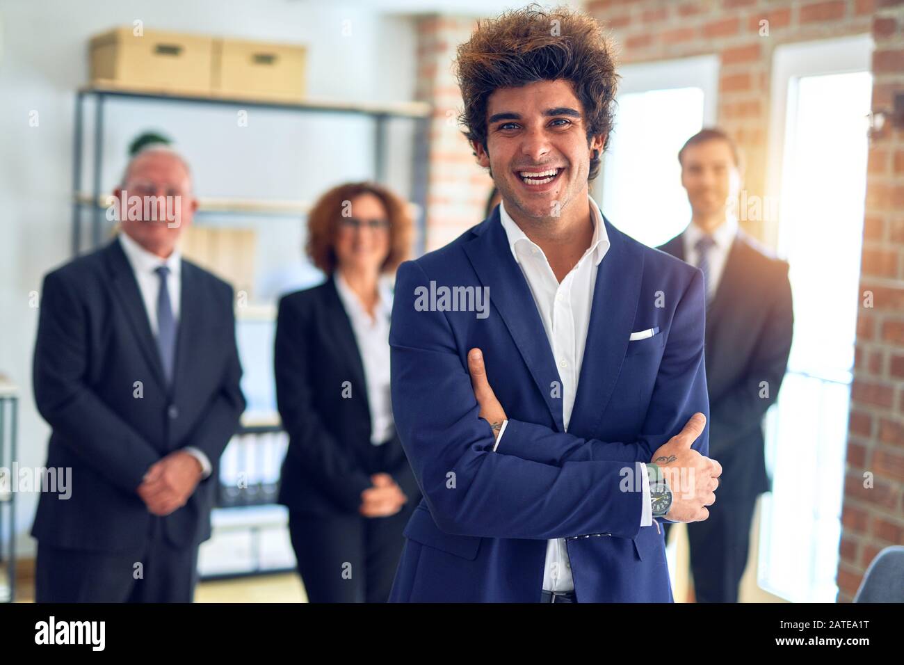 Group of business workers smiling happy and confident in a meeting ...
