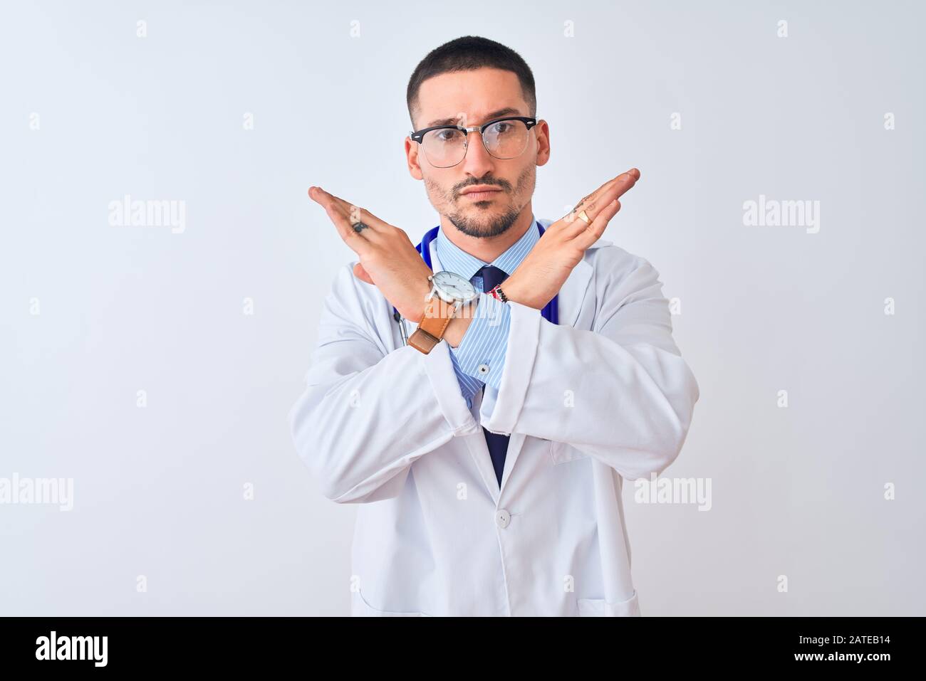 Young doctor man wearing stethoscope over isolated background Rejection ...