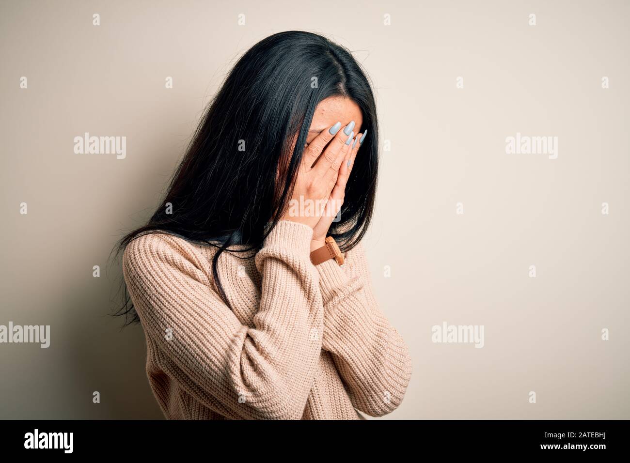 Young beautiful chinese woman wearing casual sweater over isolated ...