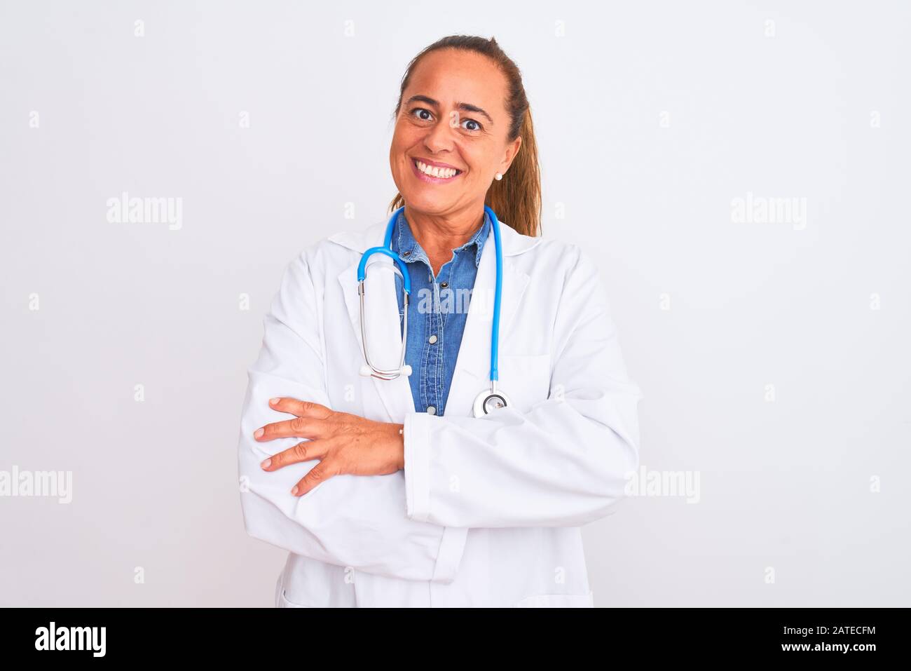 Middle age mature doctor woman wearing stethoscope over isolated ...