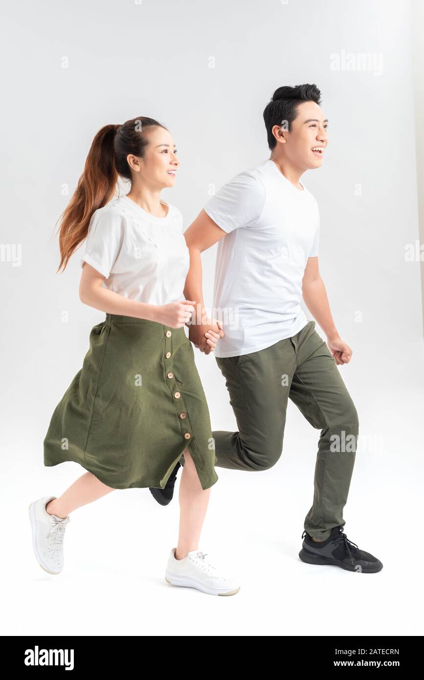 in full growth. young couple walking together Stock Photo - Alamy