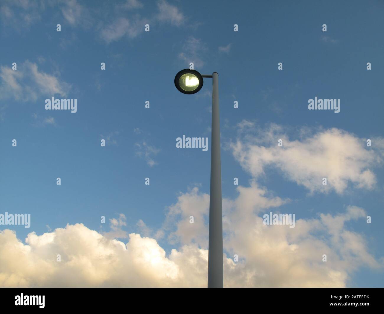 Light posts with clouds in backgrounds Stock Photo - Alamy