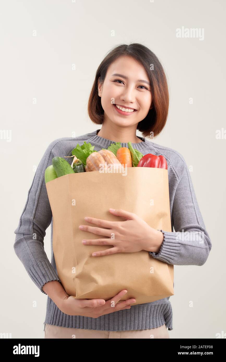 Beautiful Smiling Asian Woman Holding Paper Shopping Bag Full Of