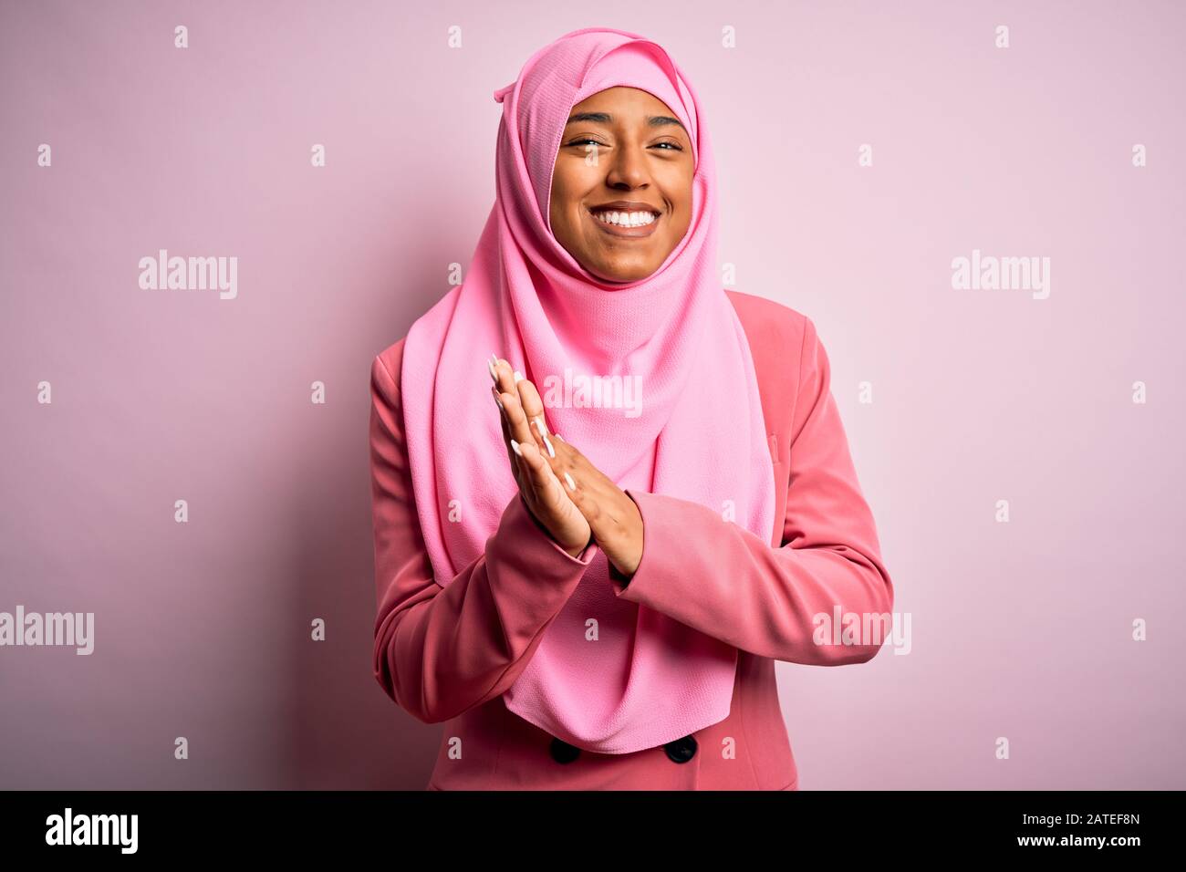 Young African American afro woman wearing muslim hijab over isolated ...
