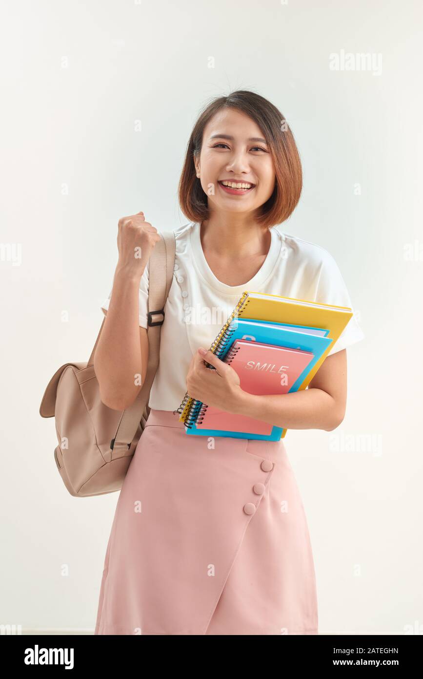 Young happy attractive asian student smiling to camera expression ...