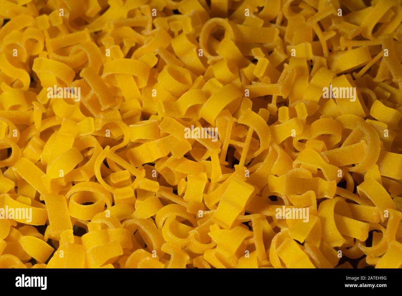 Pasta in the form of letters of the English alphabet and numbers. Close ...