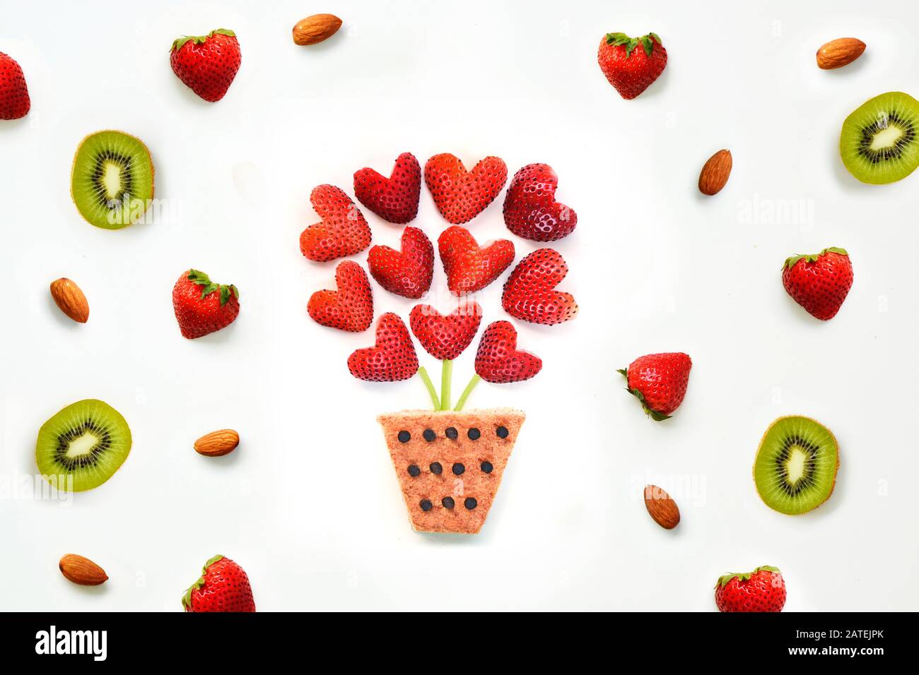 Red flowers in a pot created with healthy food Stock Photo - Alamy