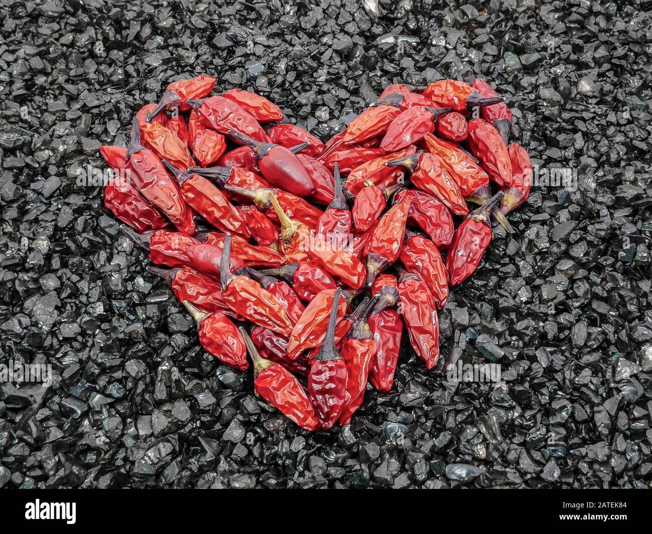 Hot chilli in heart shape hi-res stock photography and images - Alamy
