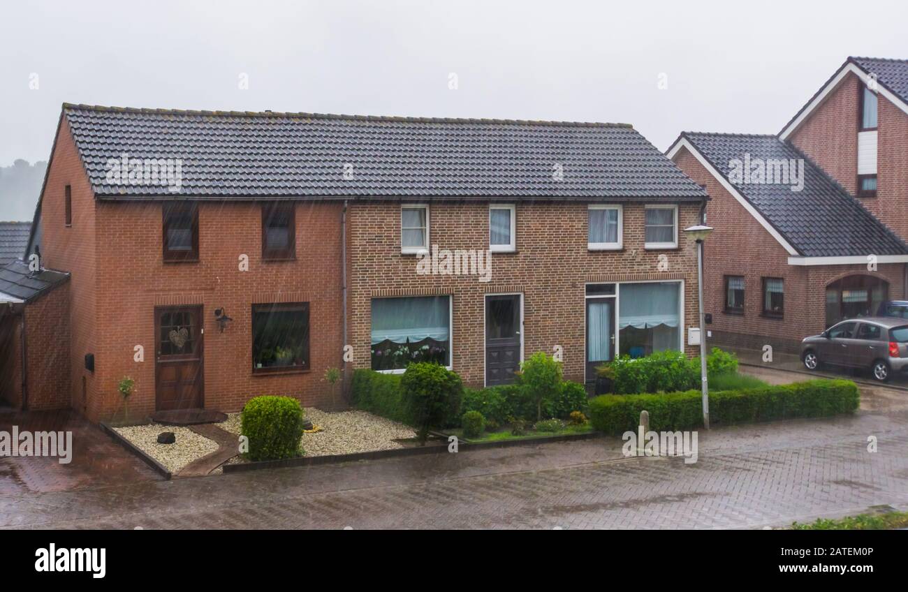 village houses during rainy weather in Rucphen, a small village in the ...