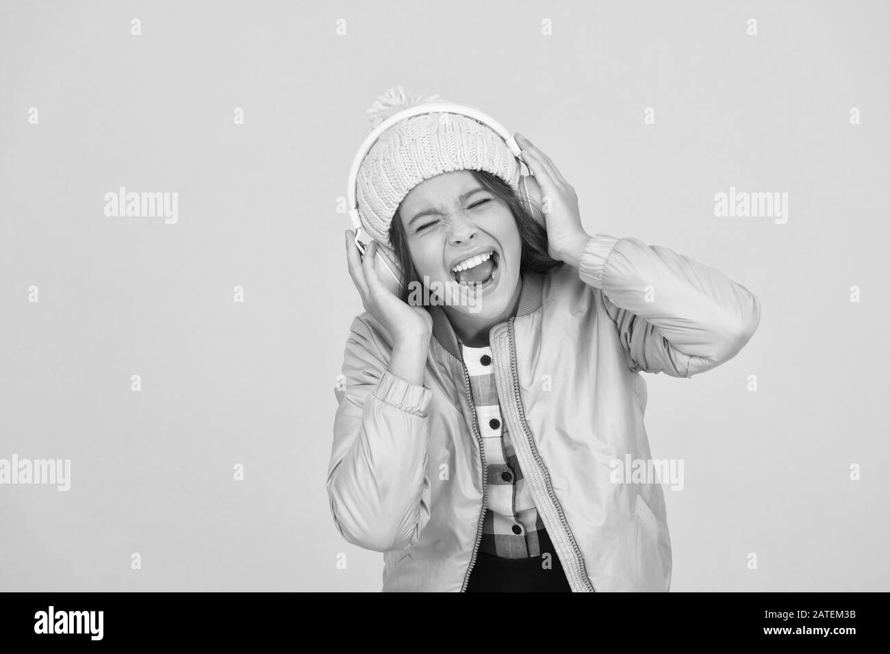 Dedicated to singing. Small singer yellow background. Happy girl enjoy ...