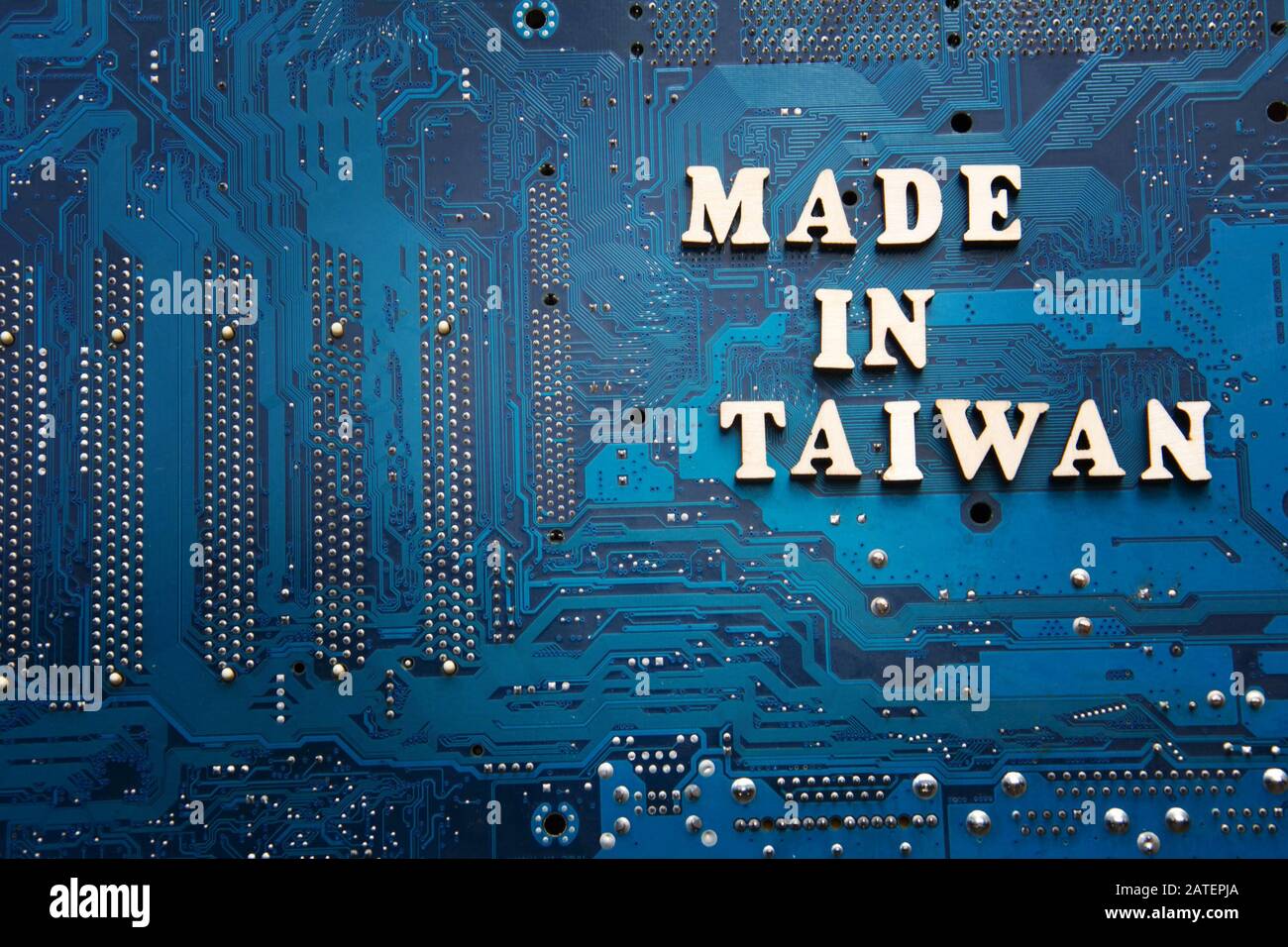 Inscription Made in Taiwan on a blue electronic printed circuit board ...
