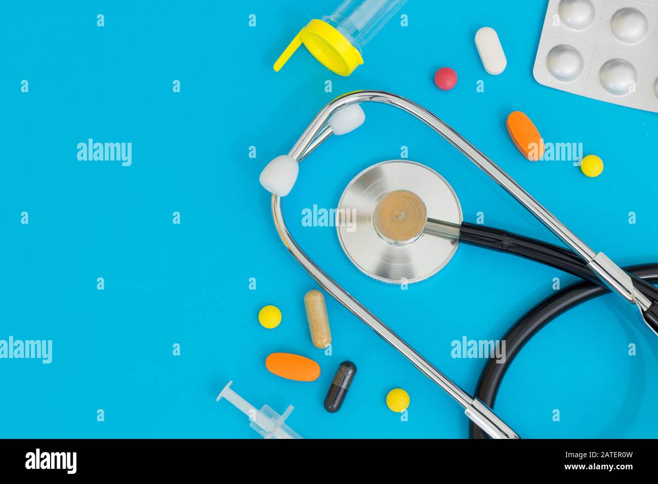 Spilled medication that with a stethoscope, laboratory vial, syringe ...