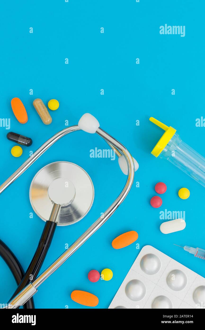 Spilled medication that with a stethoscope, laboratory vial, syringe ...