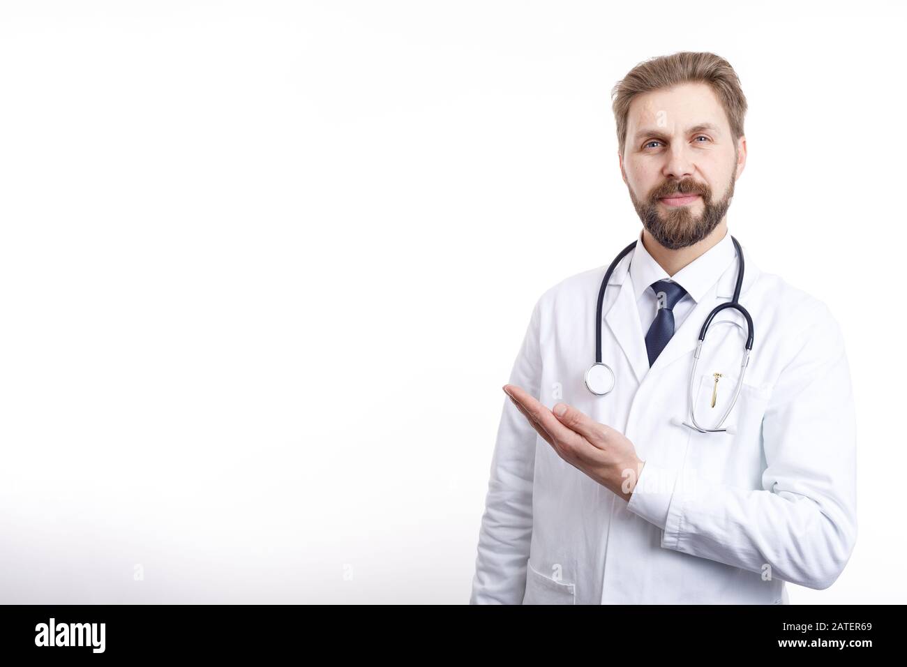 Handsome smiling bearded MD in white smock making an invitation hand ...