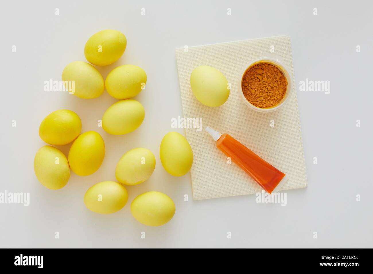 Above view of pastel yellow Easter eggs with natural color dye ...