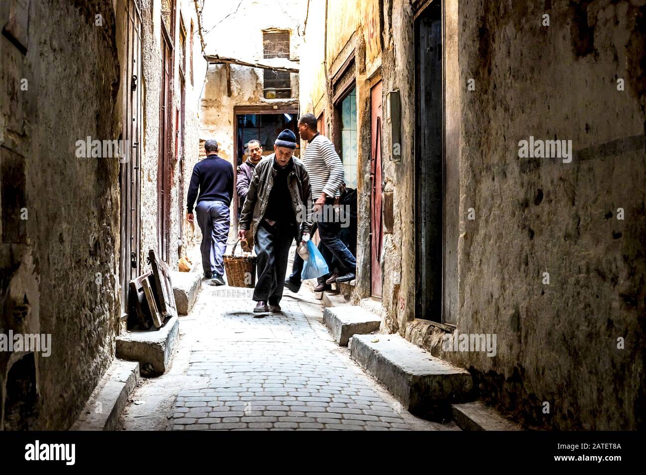 The streets of the old town of Fez, which are locals and children ...