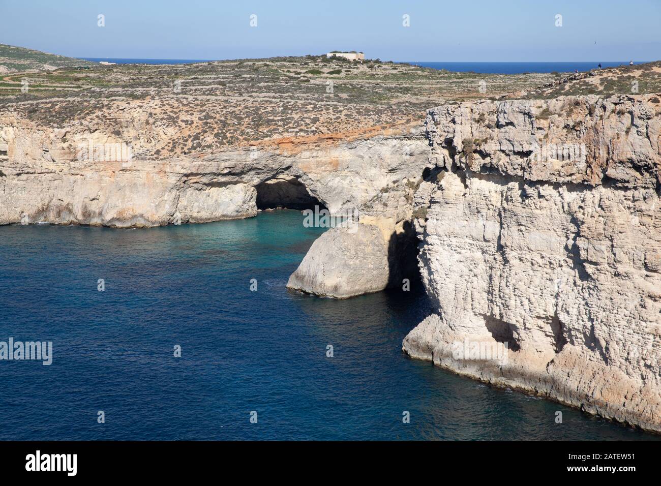 Crystal Lagoon caves view from ship, Comino, Malta Stock Photo - Alamy
