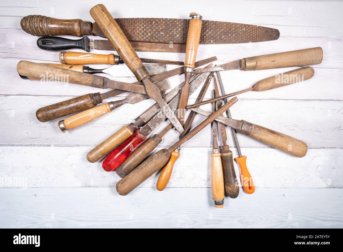 Sets of different wood rasps of different sizes and wood chisels in the ...