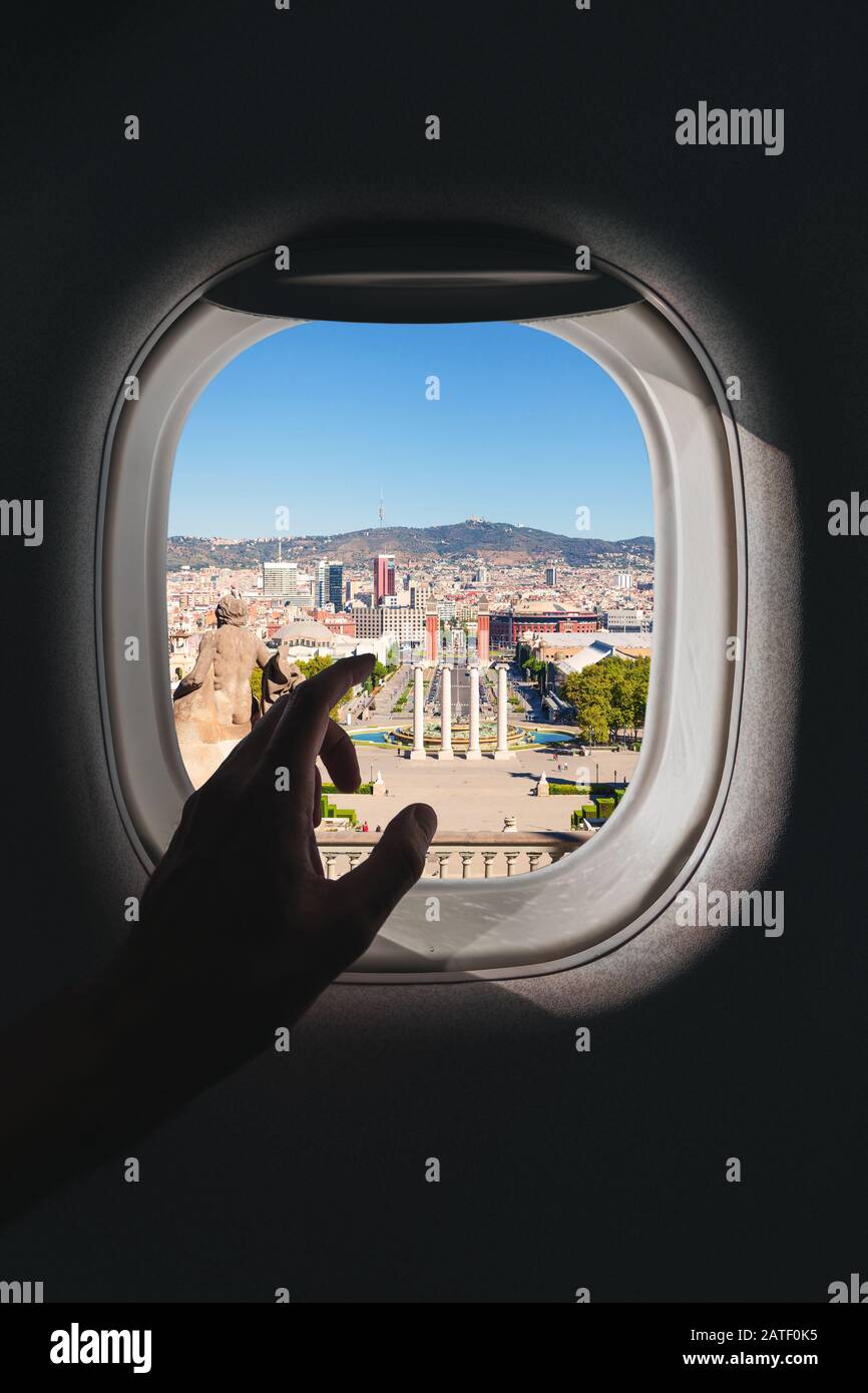 Airplane window with a aerial panorama of Barcelona, Spain with city ...