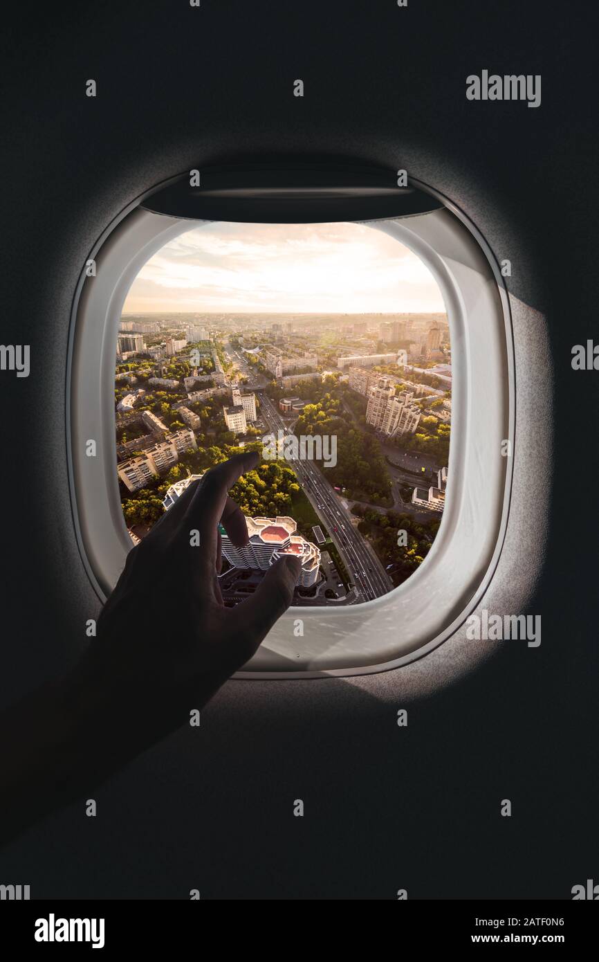 Airplane window with a aerial panorama of Kiev, Ukraine during a flight ...