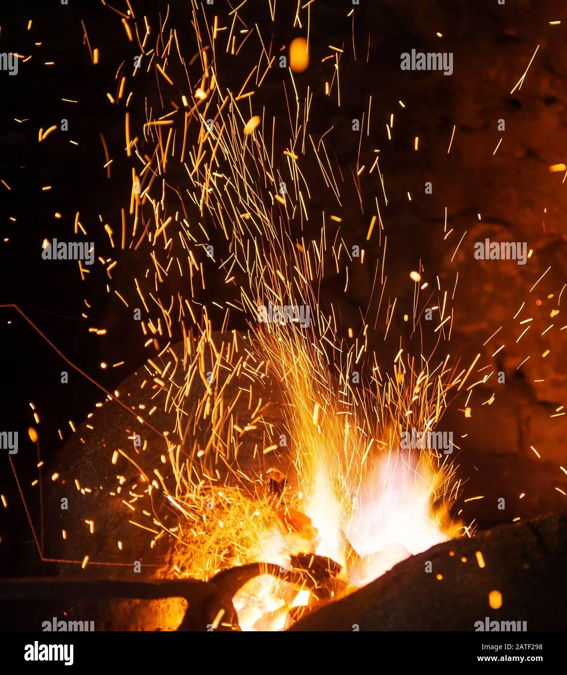 Smithy fire flame tips with sparks closeup on dark background Stock ...