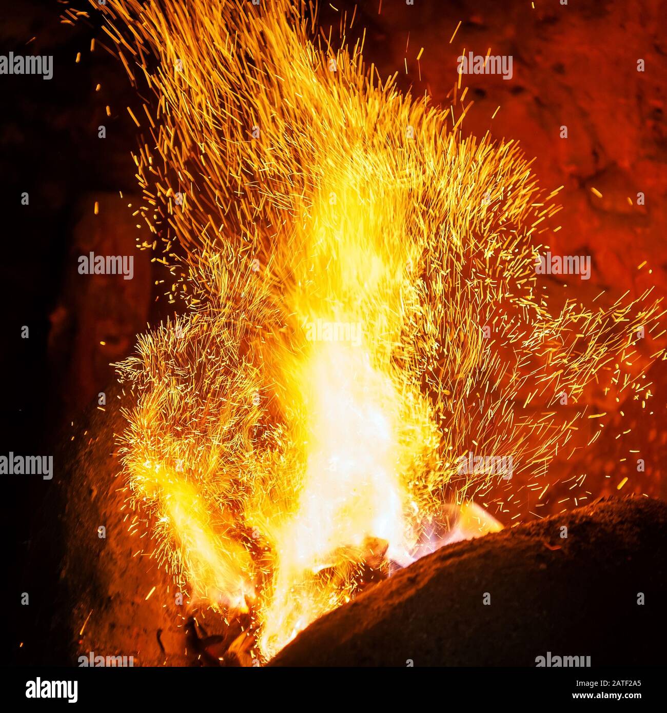 Smithy fire flame tips with sparks closeup on dark background Stock ...