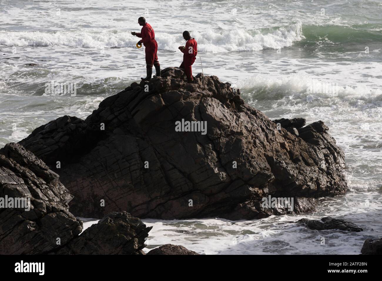 Men fishing from a rock, Toco, Trinidad & Tobago Stock Photo - Alamy